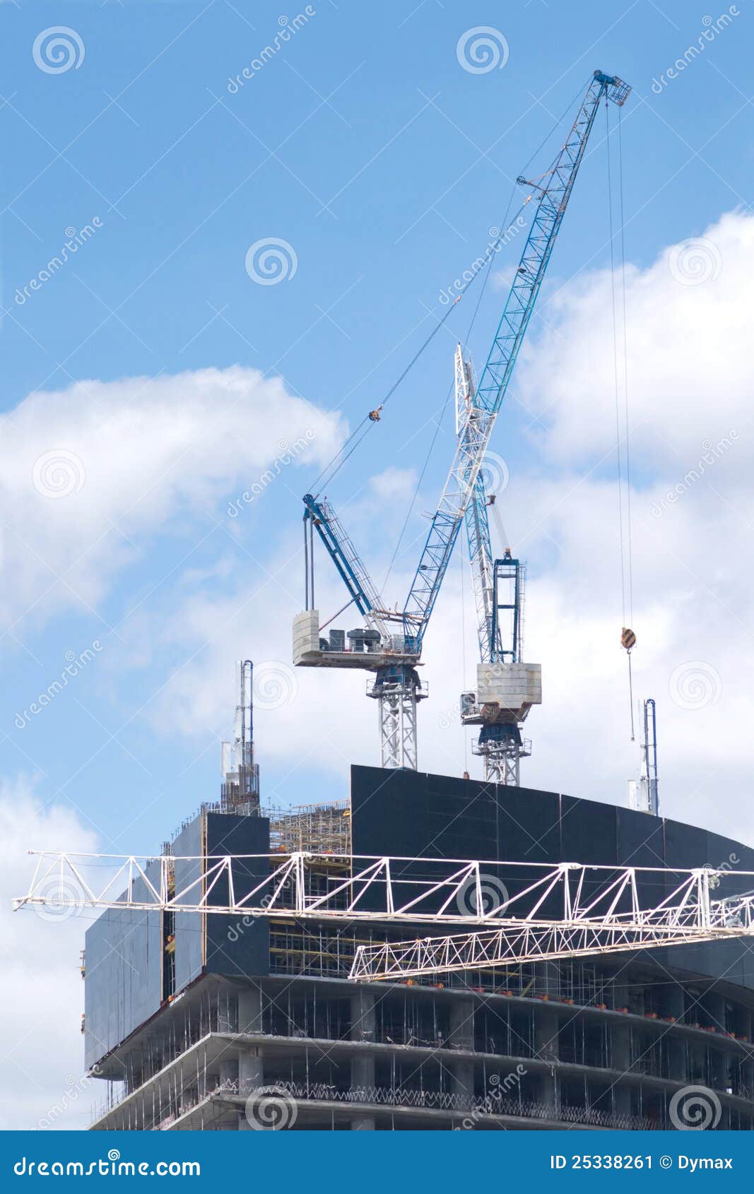 Hoisting Tower Cranes, and Top of Building Stock Image - Image of ...