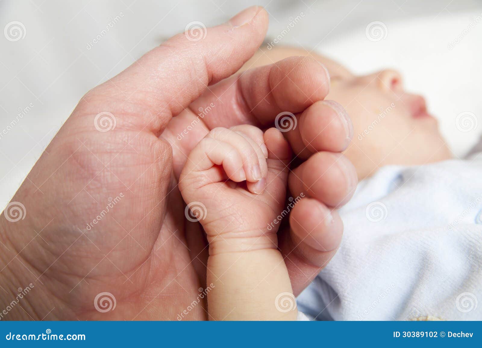 Hold a Hand of the Newborn Child Stock Photo - Image of protection ...