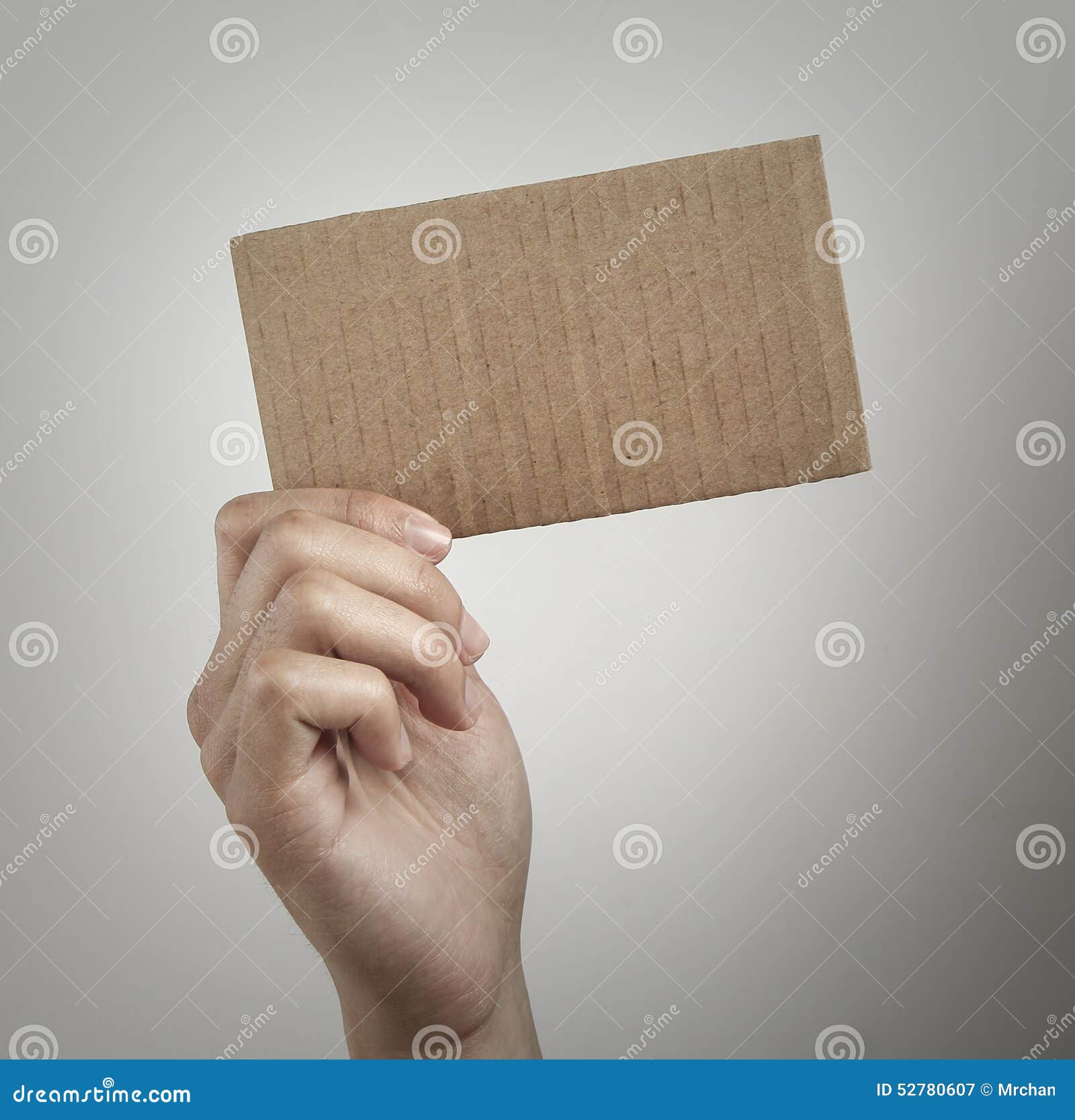 Holding blank brown card stock image. Image of figure - 52780607