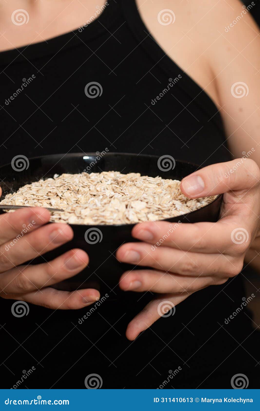 Holding a Bowl Full of Rolled Oats. Hands Securely Holding a Bowl ...
