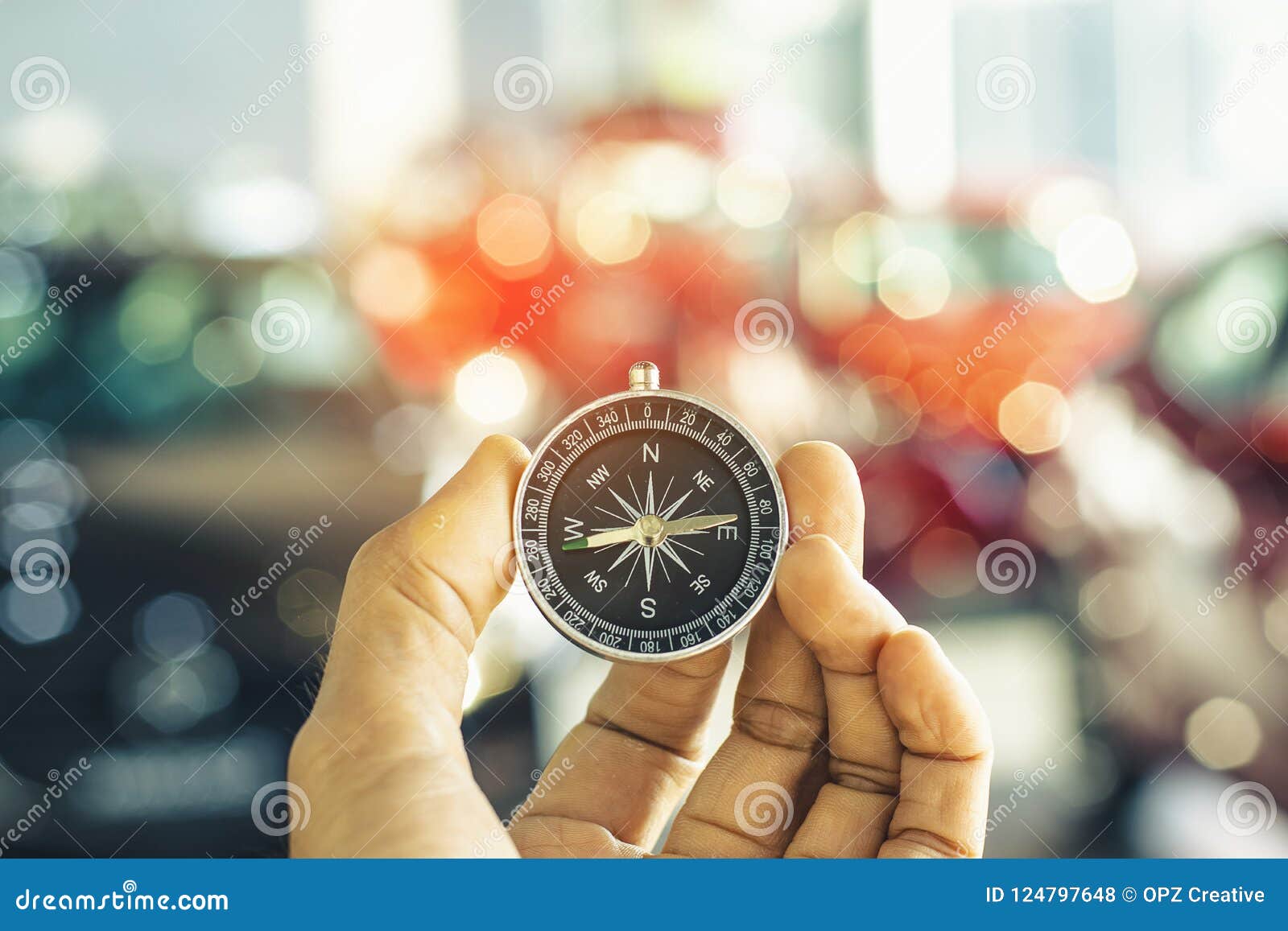 Holding Compass on Blurred Background. Using Wallpaper or Background ...