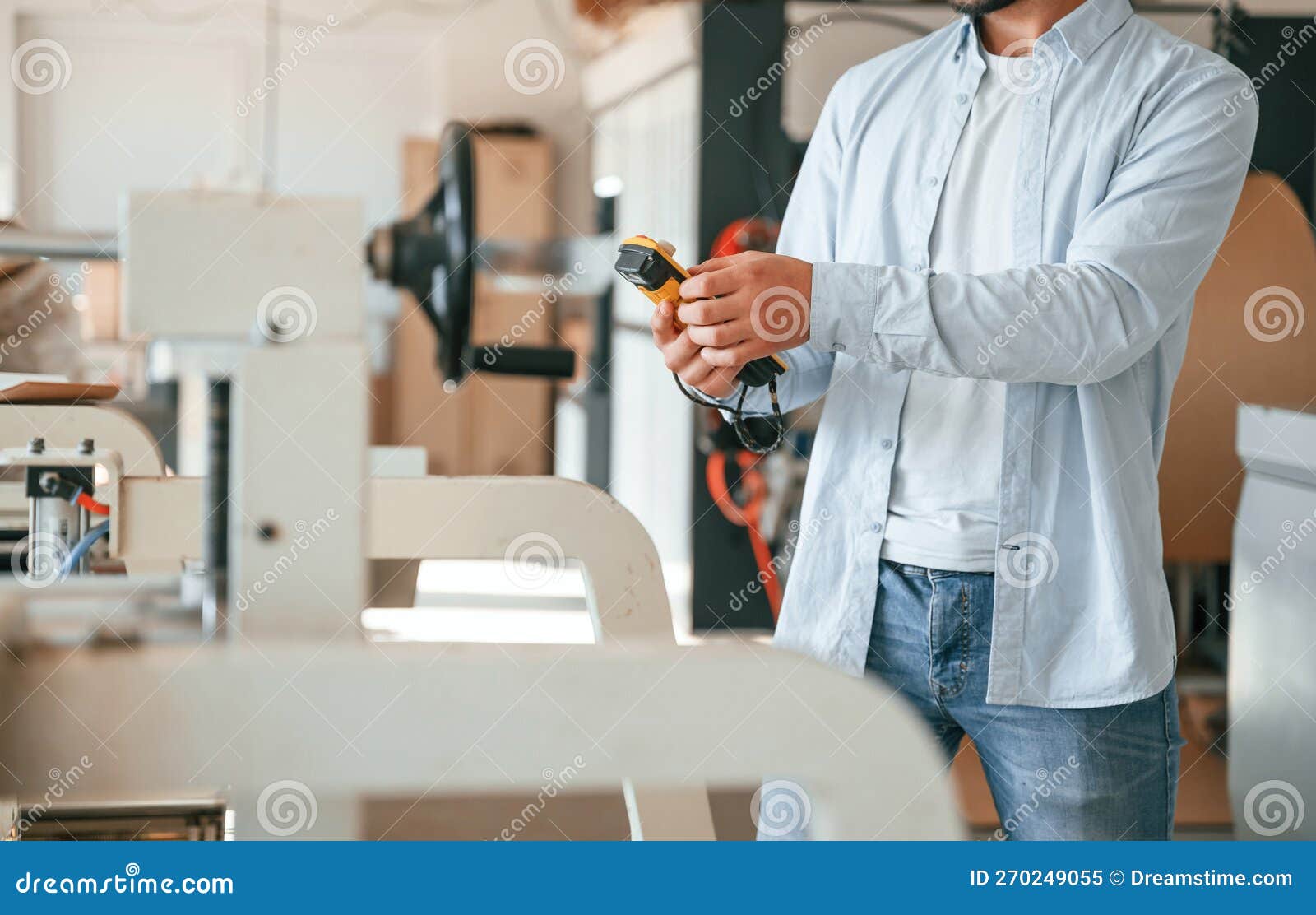 Holding Controller of Printing Machine. Polygraph Worker in White ...