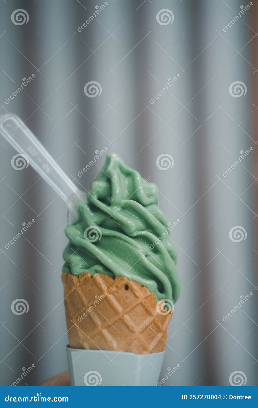 Holding a Crispy Cone of Ice Cream Soft Serve with Matcha Flavour Stock ...