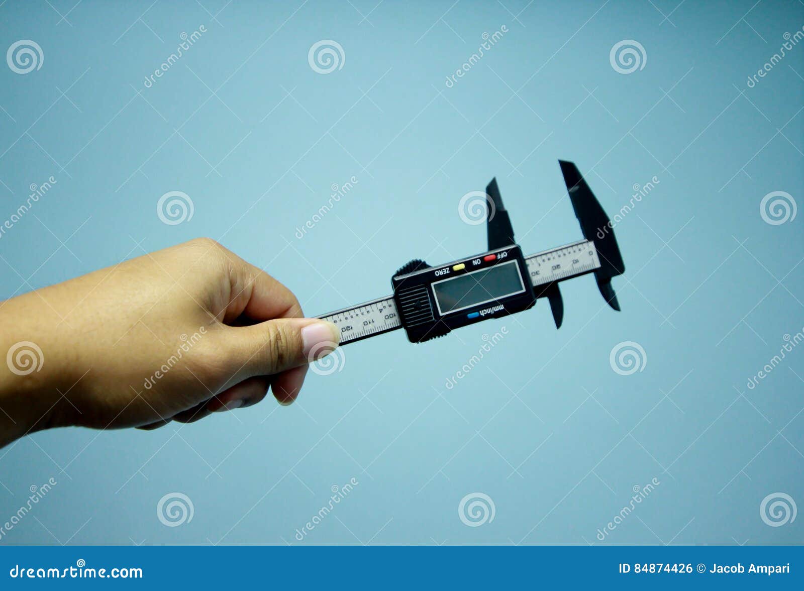 Holding a Dial Calipers stock photo. Image of measurement - 84874426