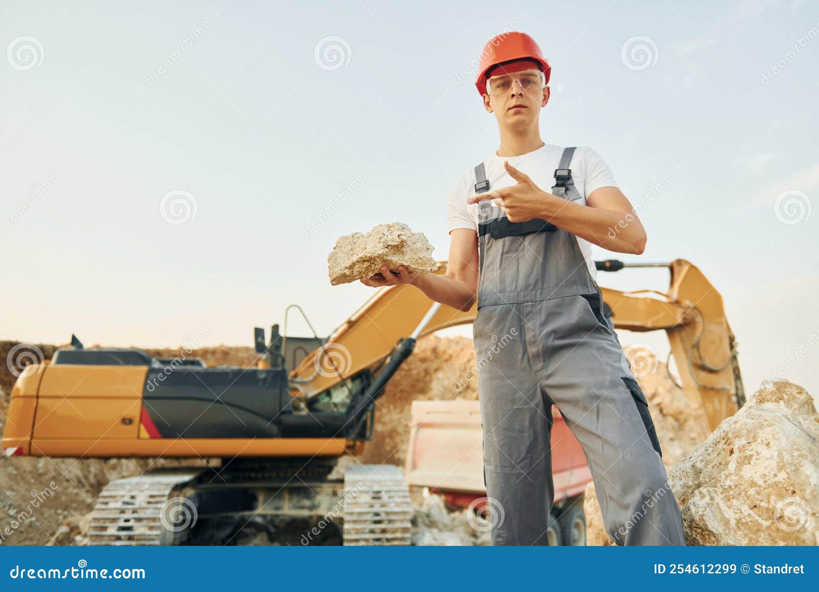 Holding Documents in Hands. Worker in Professional Uniform is on the ...