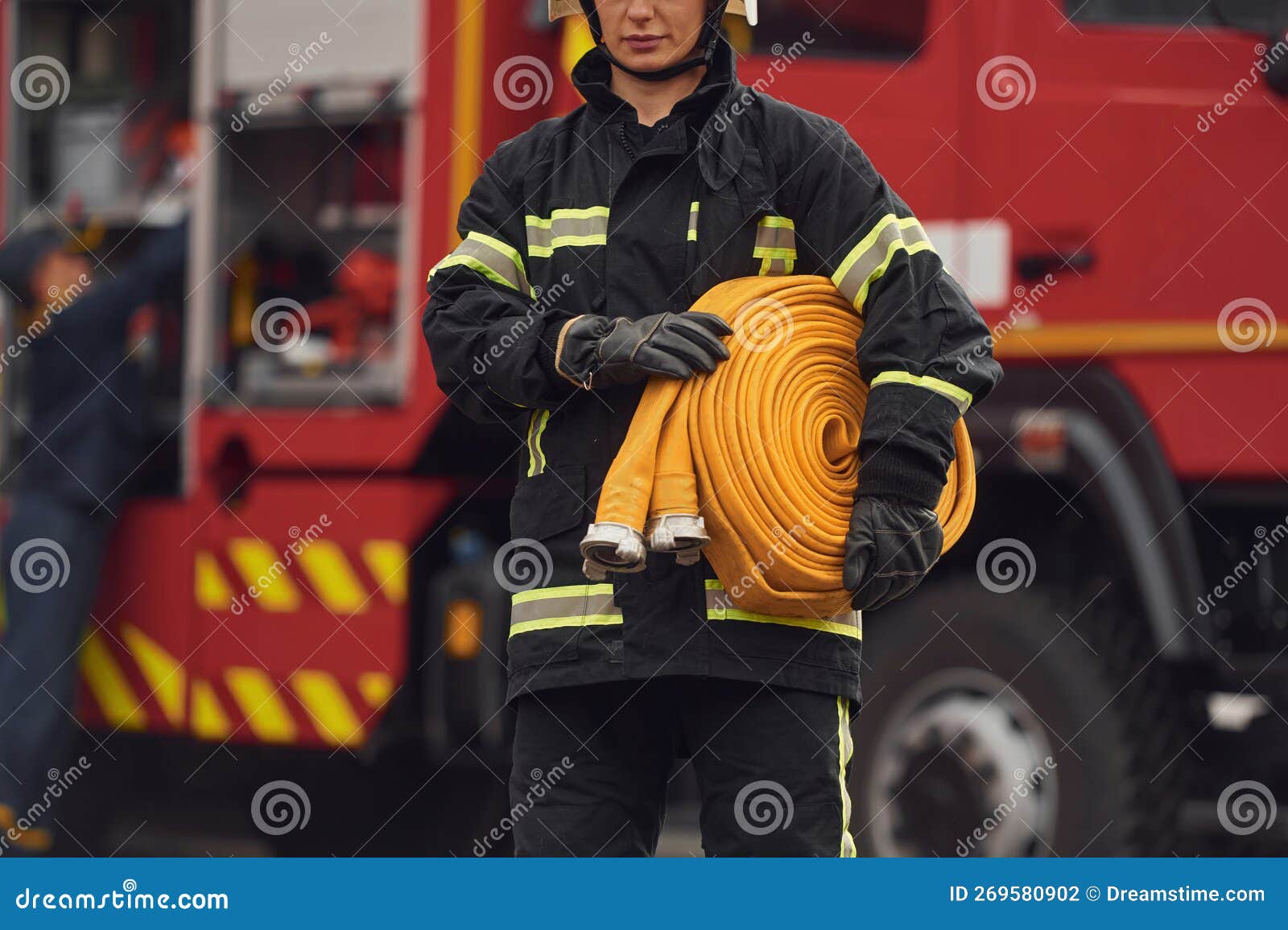 Holding Fire Hose. Woman in Uniform is at Work in Department Stock ...