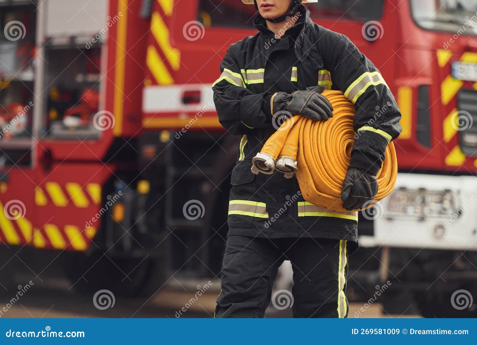 Holding Fire Hose. Woman in Uniform is at Work in Department Stock ...