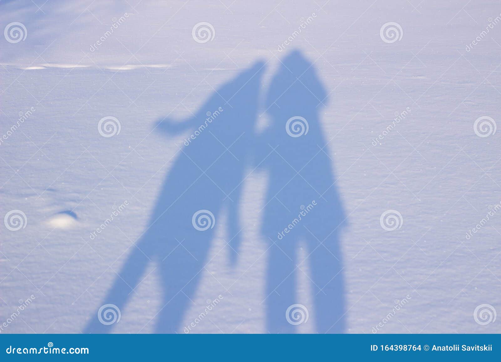 Holding Hands Creating a Shadow in the Snow Stock Photo - Image of ...
