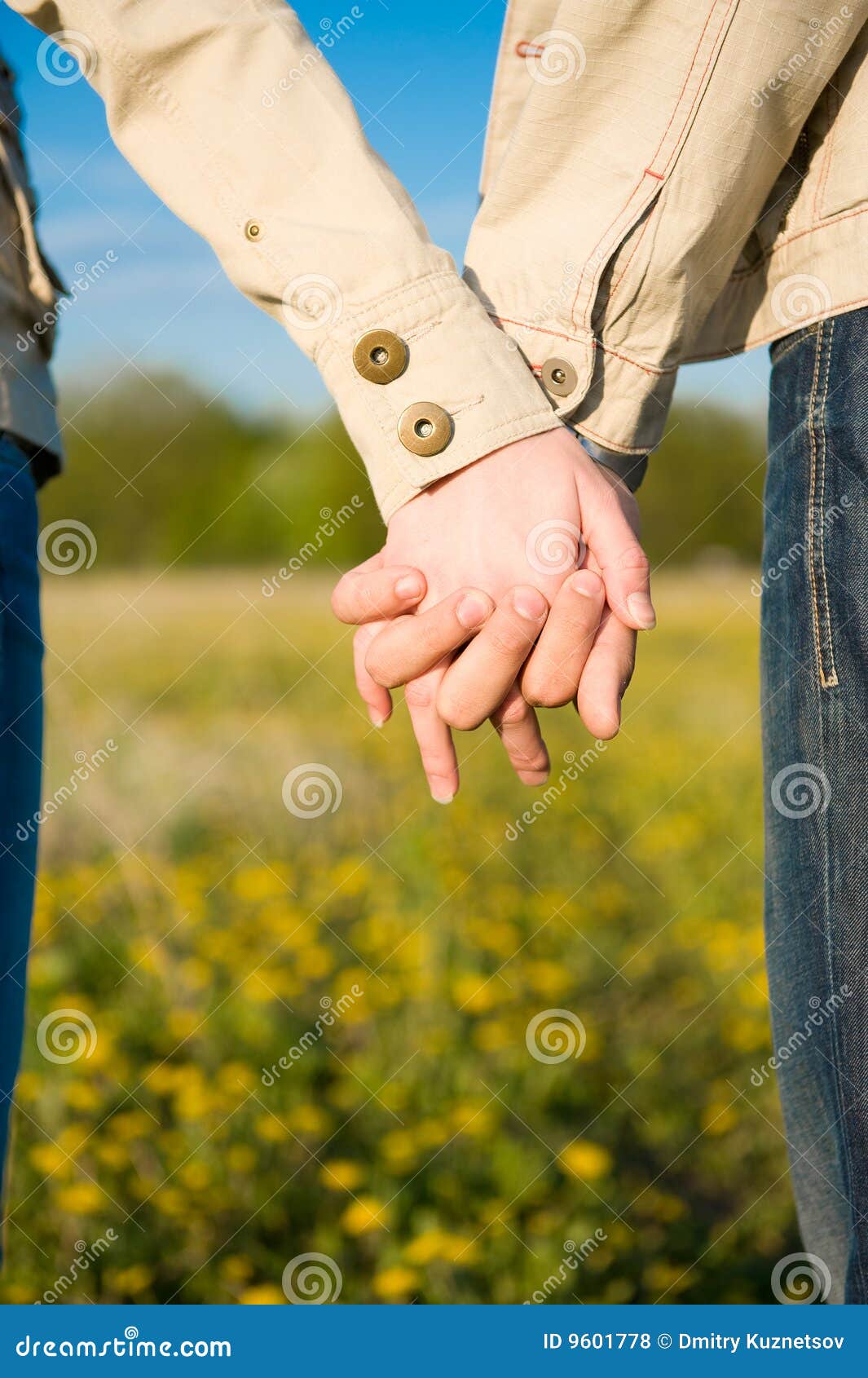 Holding hands on the field stock photo. Image of enjoying - 9601778