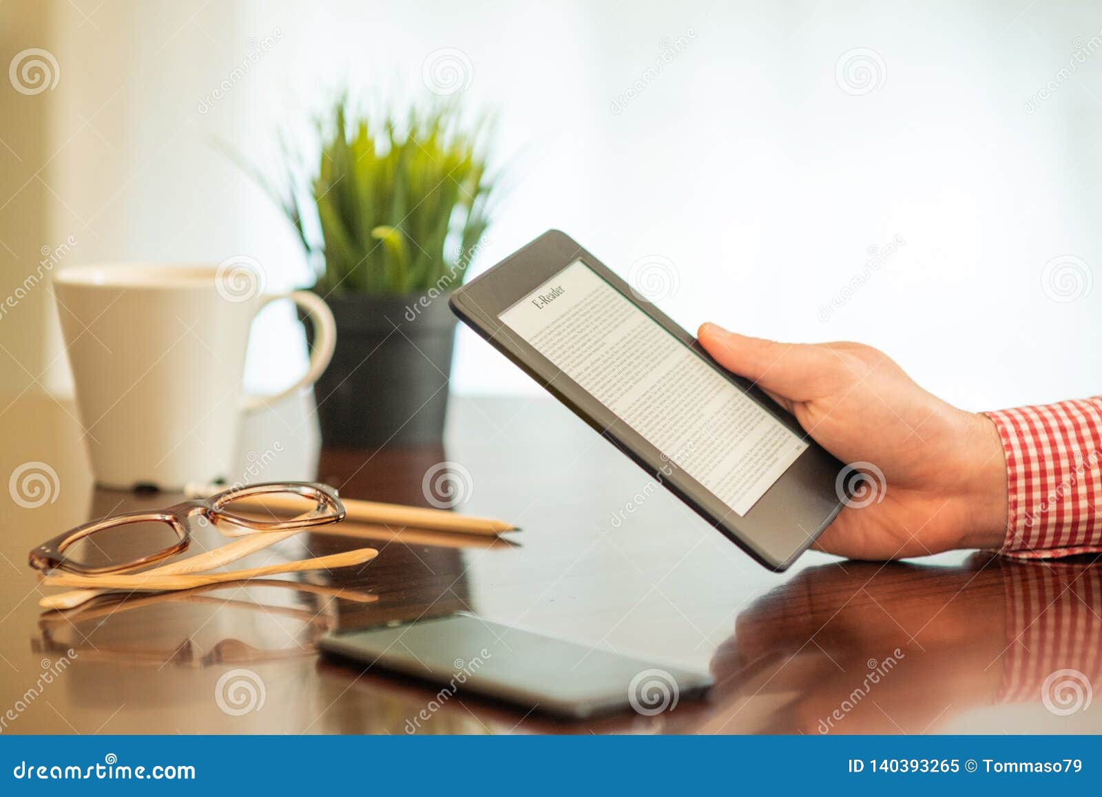 Holding in Hands a Modern Ebook Reader and Paper Books Stock Image ...