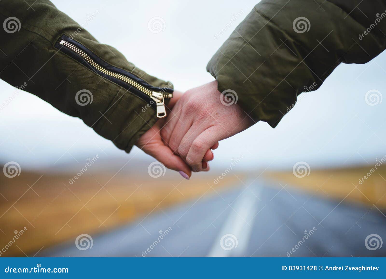 Holding Hands on Road stock photo. Image of touching - 83931428