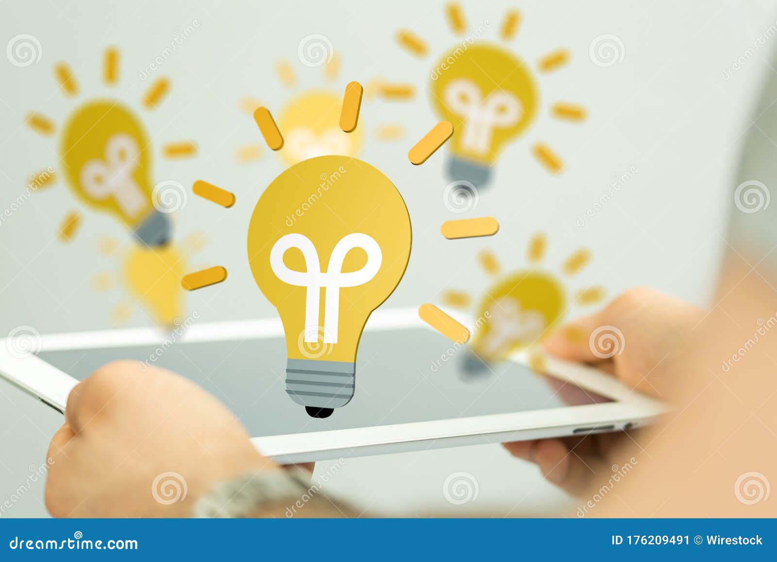 A Holding Illuminated Light Bulb, Idea, Innovation and Inspiration ...