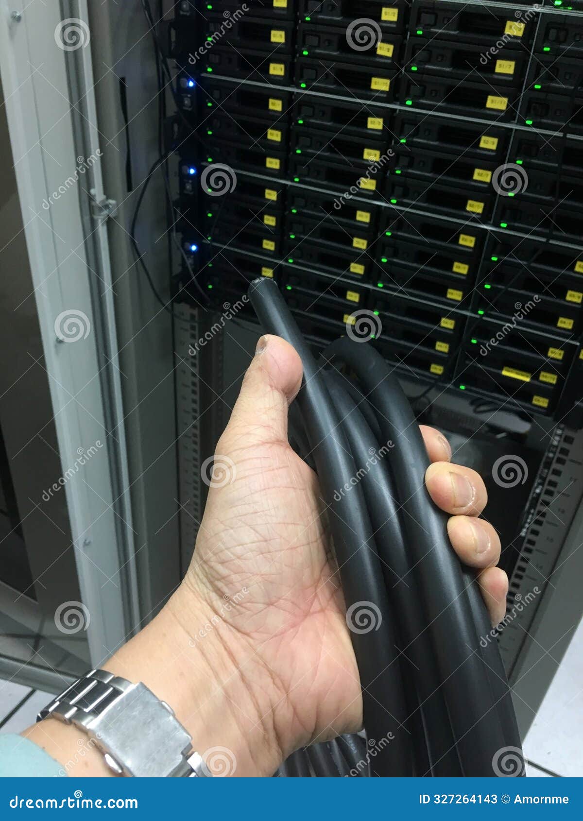 Holding a lot of cables. stock image. Image of gadget - 327264143