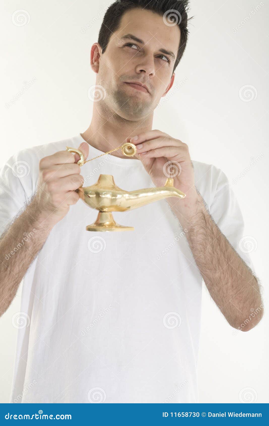 Holding a Magic Lamp stock photo. Image of male, shirt - 11658730