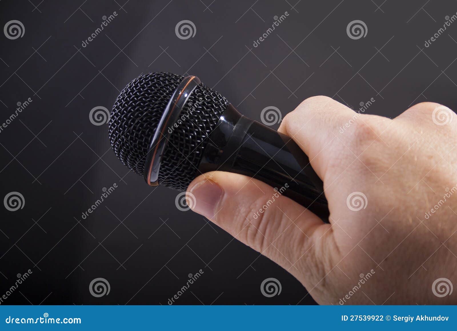 Holding microphone stock photo. Image of close, microphone - 27539922