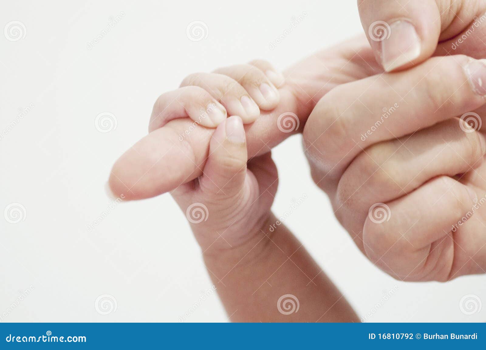 Holding Mommy s finger stock photo. Image of daycare - 16810792
