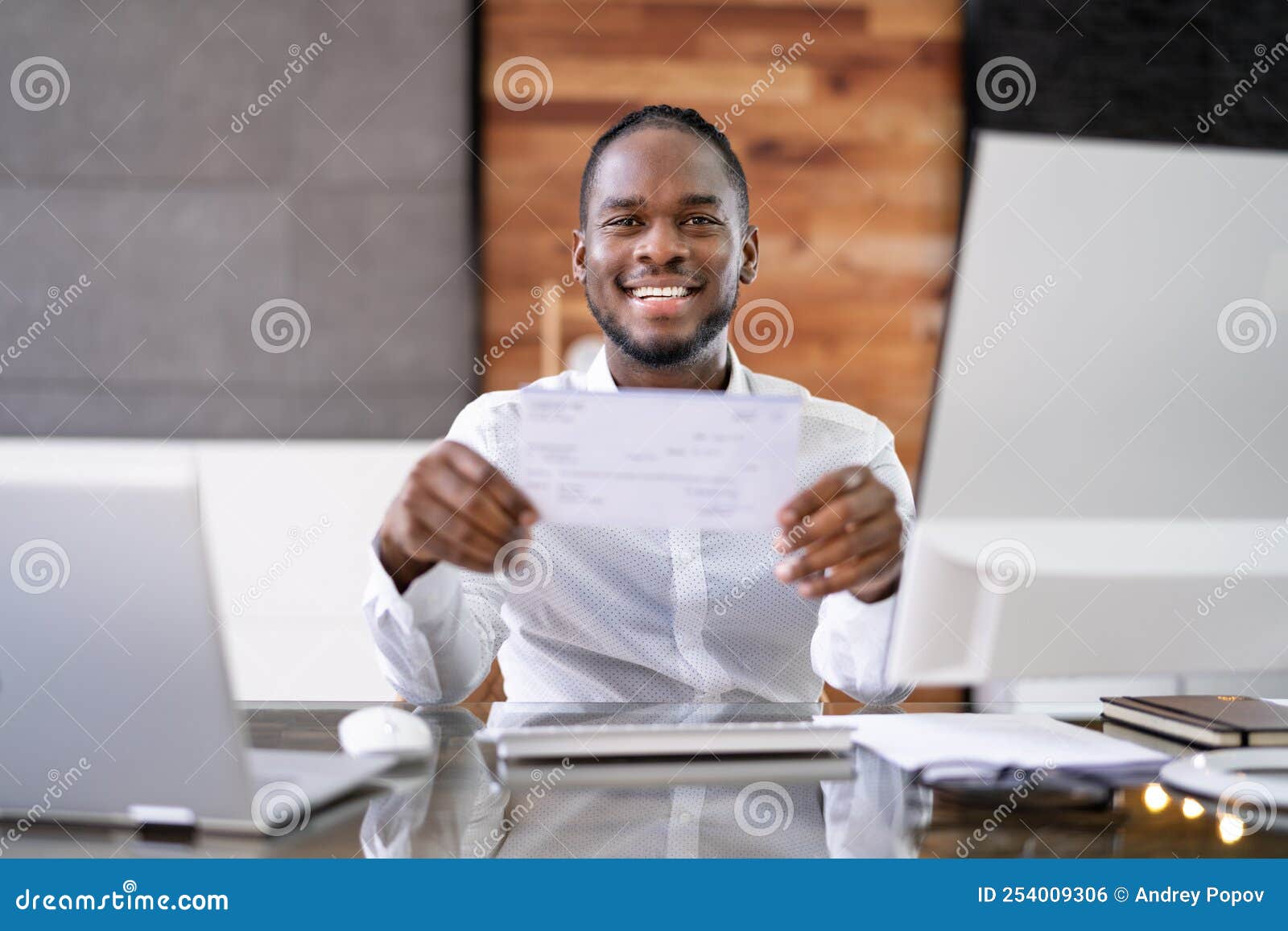 Holding Paycheck or Payroll Check or Insurance Cheque Stock Photo ...