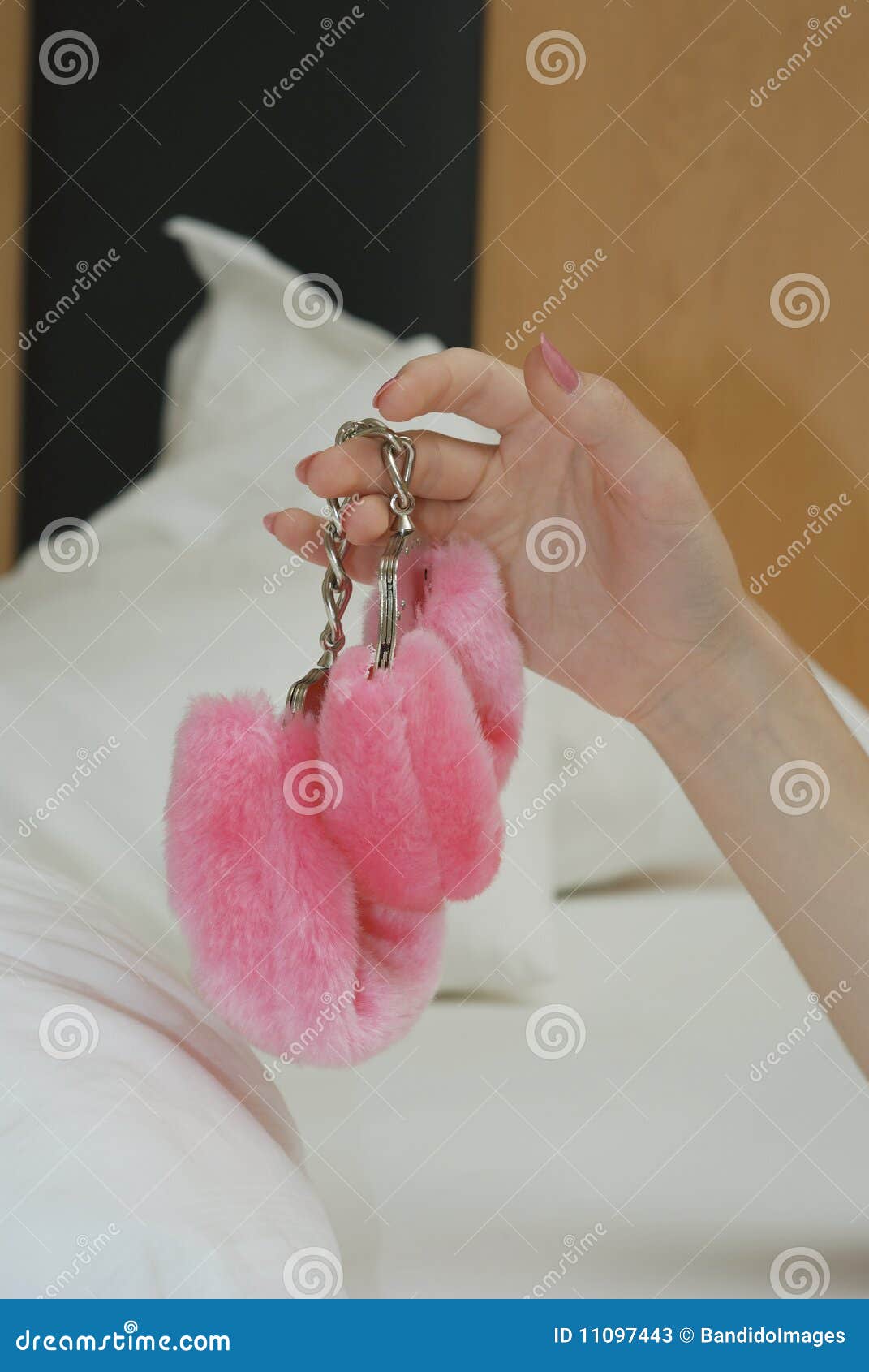 Holding pink cuffs stock image. Image of cute, girl, symbolic - 11097443