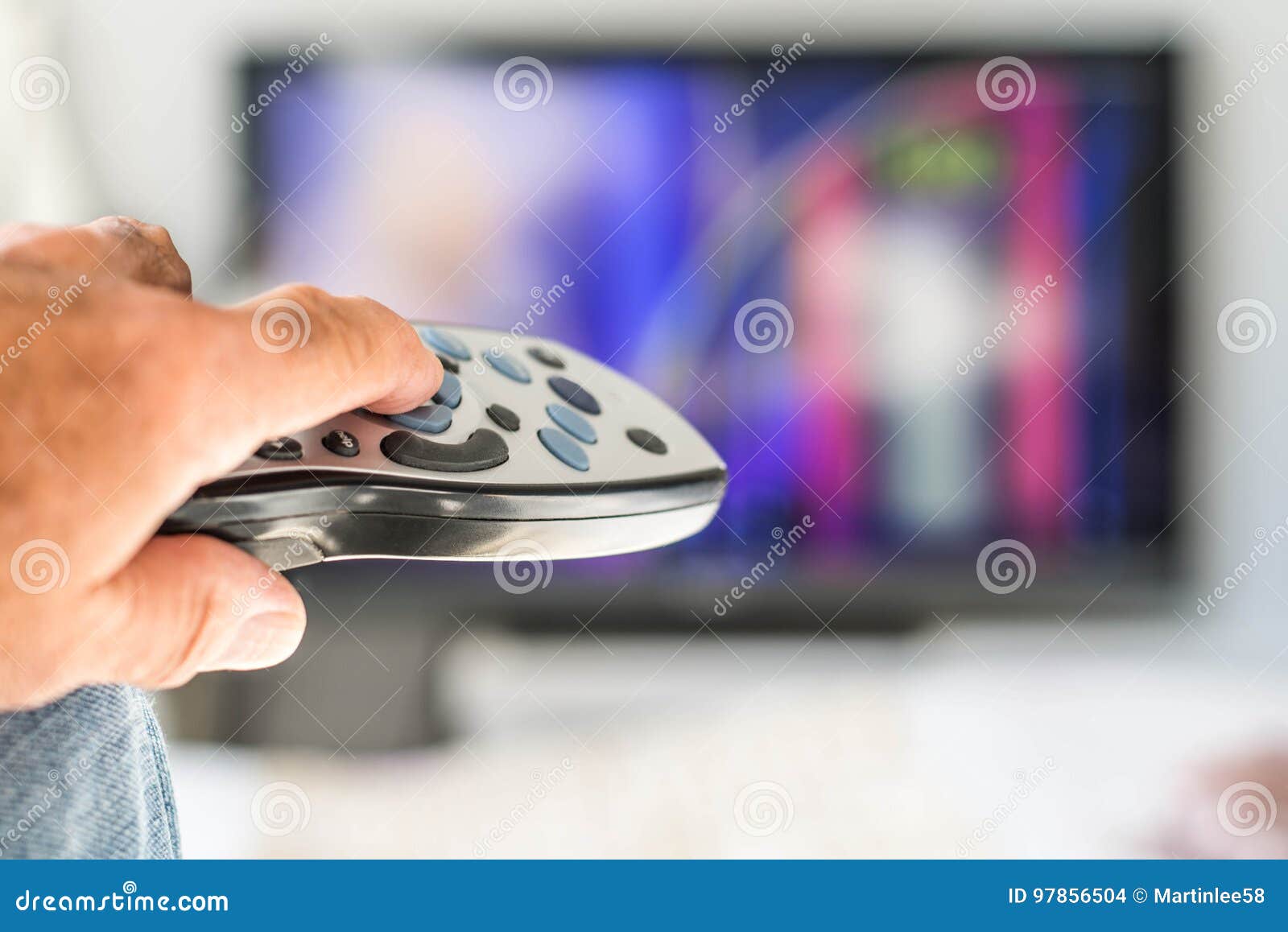 Holding and Pointing a TV Remote Control Box at a Television Stock ...