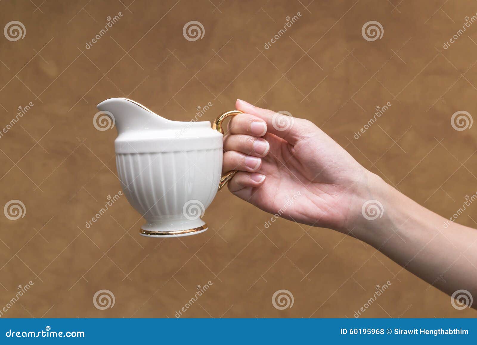 Holding a small pitcher stock photo. Image of earthenware - 60195968