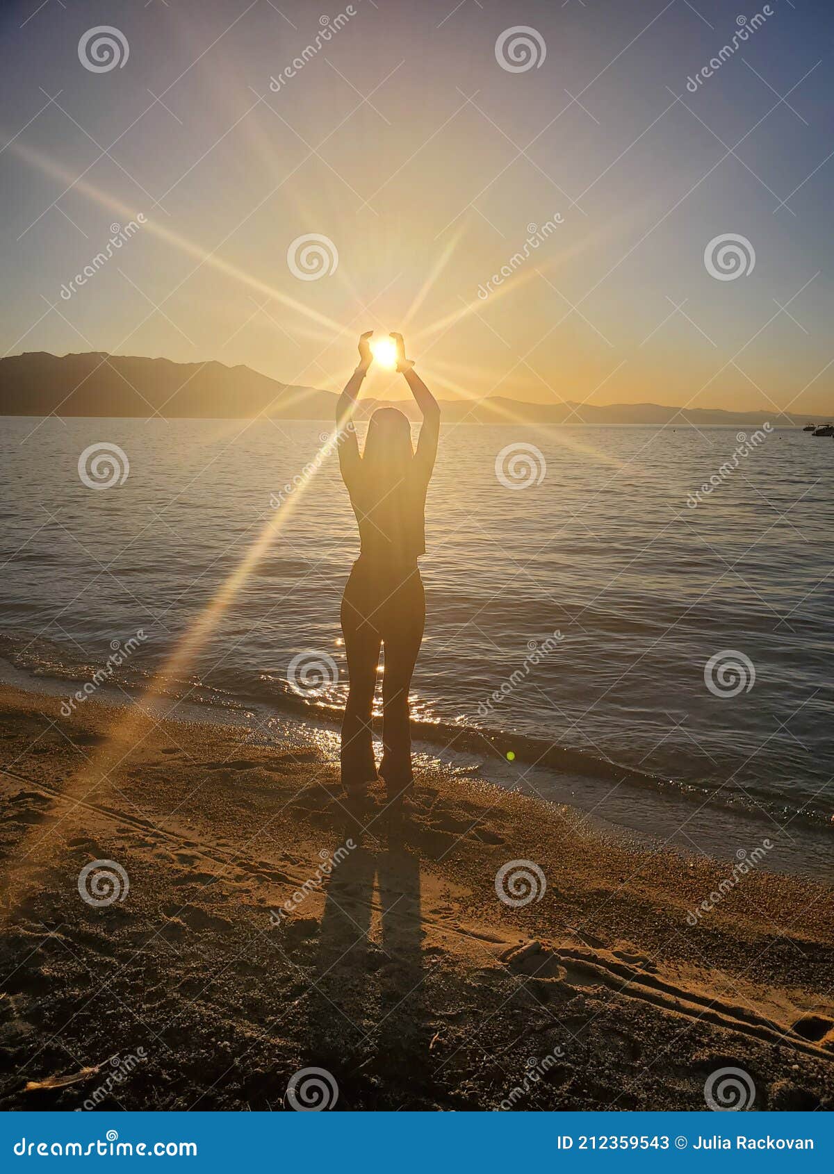 Holding the sun stock image. Image of water, yellow - 212359543