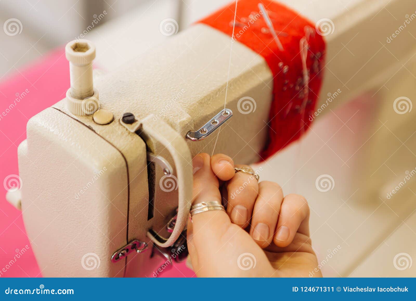 Careful Dressmaker Holding Thread while Working with Sewing Machine ...