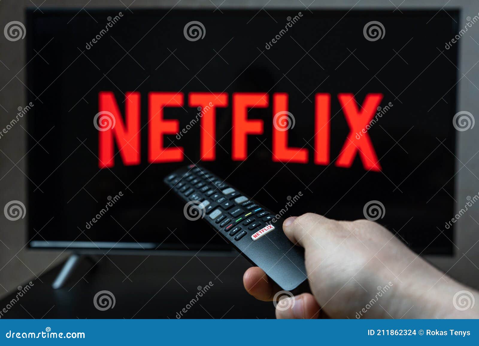 Holding TV Remote Controller with Netflix Logo. Editorial Stock Image ...