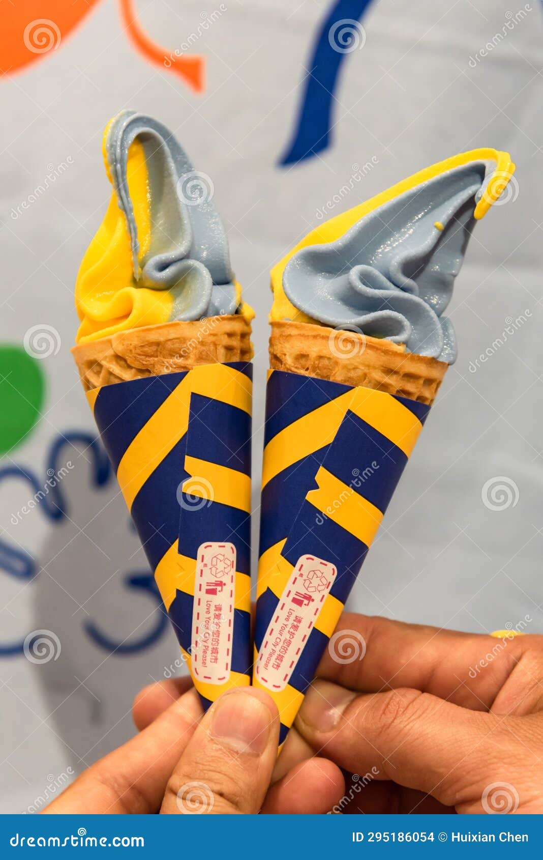 Holding Two Two-tone Ice Cream Cones in Both Hands. Stock Photo - Image ...