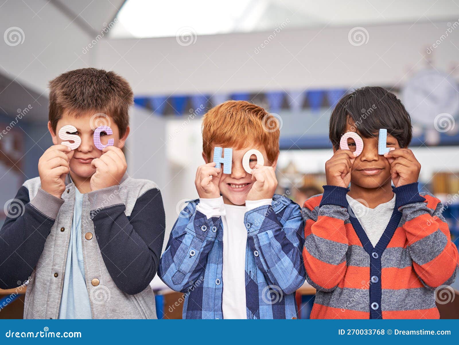 Holding Up Their Favourite Letters. Elementary School Children in Class ...
