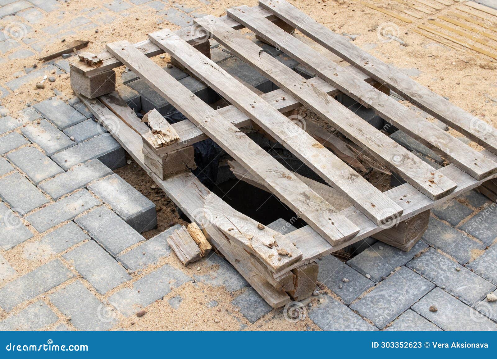 Hole in Asphalt is Covered with Wooden Pallet Stock Image - Image of ...