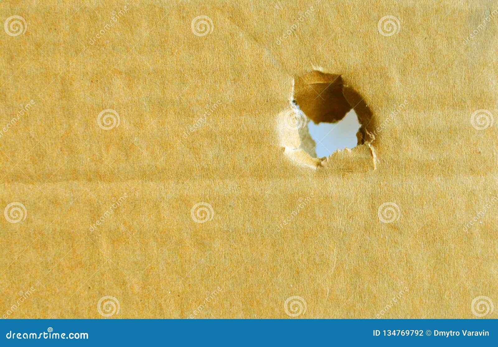 Hole in a cardboard stock photo. Image of packet, crushed - 134769792