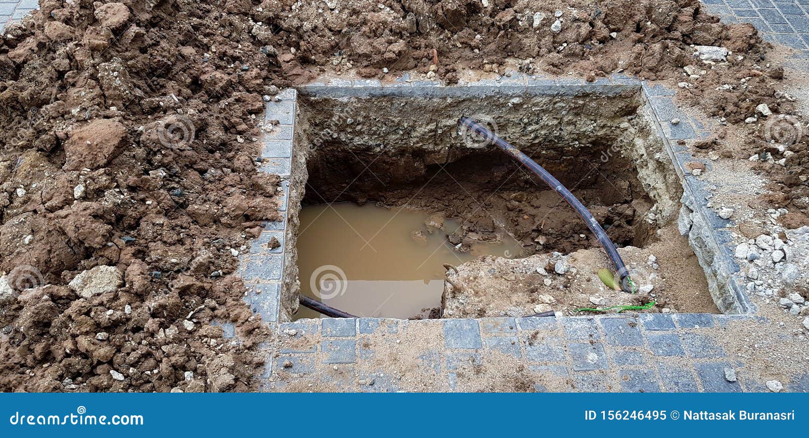 Hole for Installation Pillar or Pole on Cement Ground with Water and ...