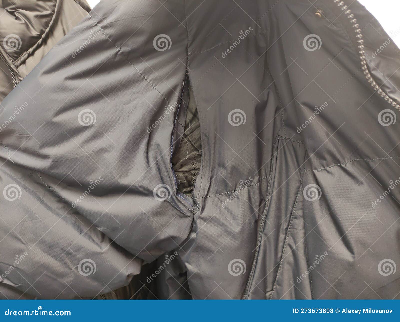 Hole in the jacket lining stock photo. Image of lining - 273673808