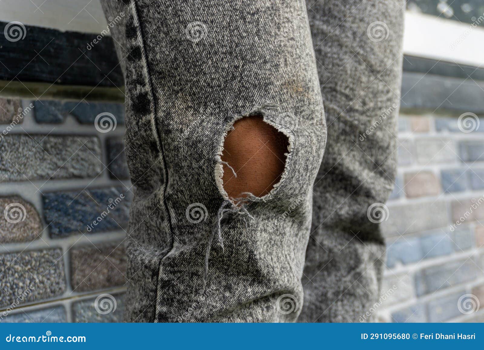 Hole in the Knee of the Jeans. Ripped Jeans in the Knee Stock Photo ...