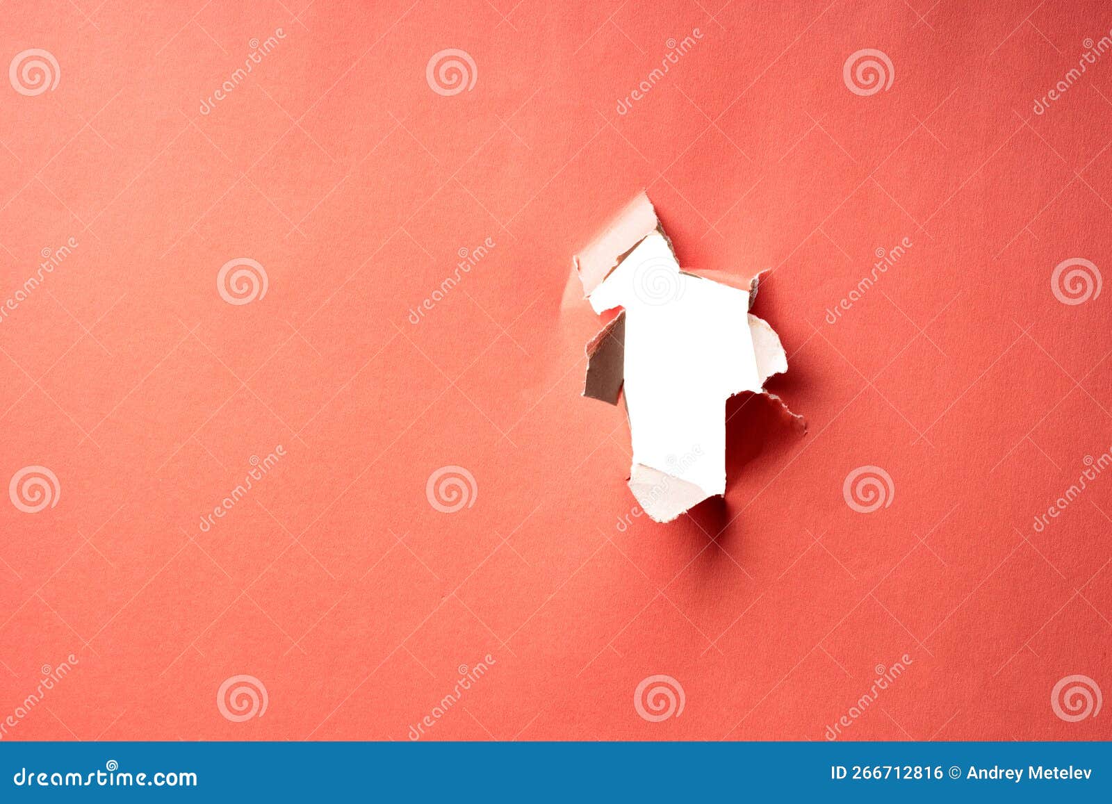 A through Hole in Peach-colored Paper with Torn Edges Stock Photo ...
