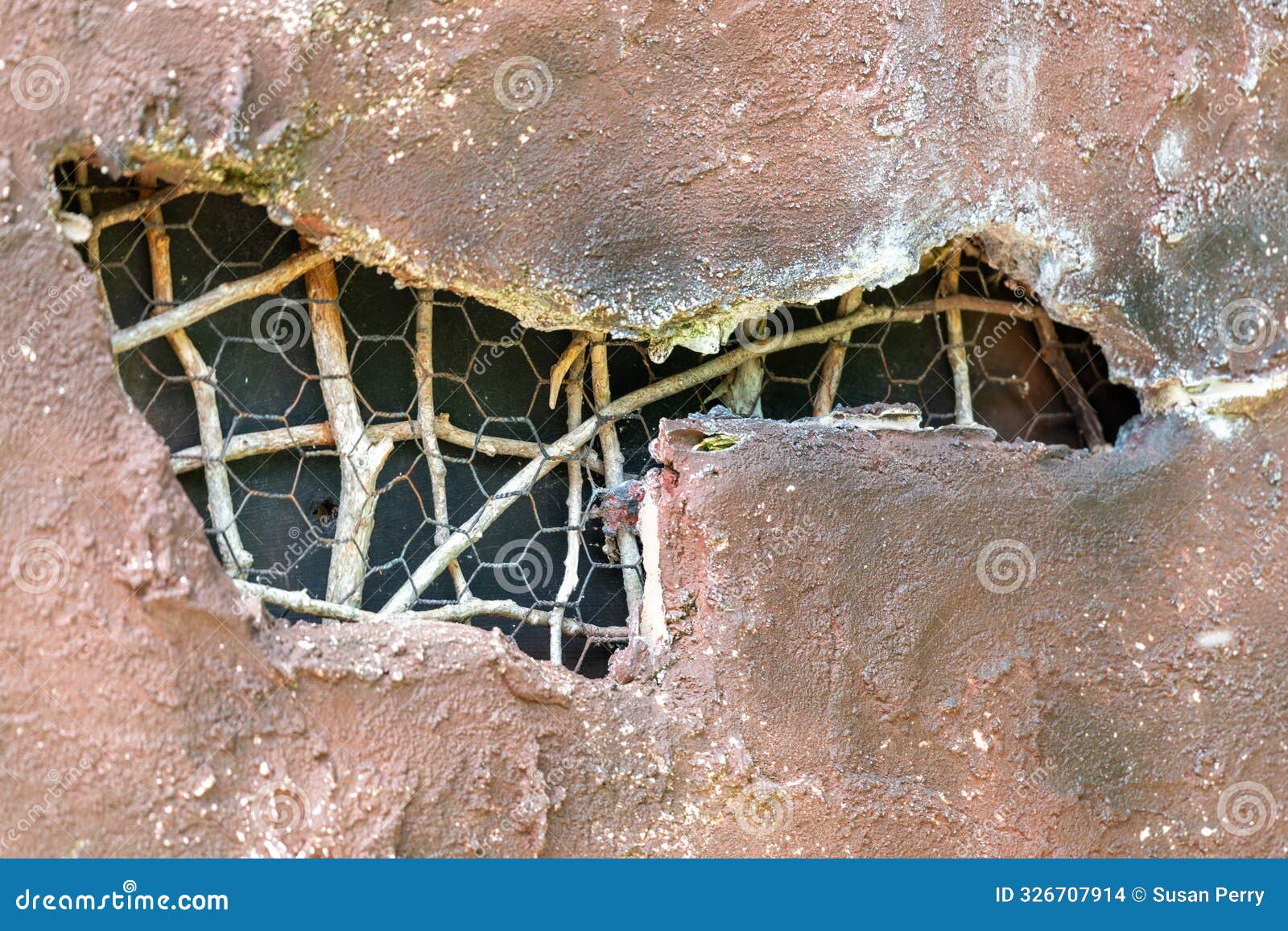 Hole in Plaster Brown Wall with Wires and Twigs Inside Stock Photo ...