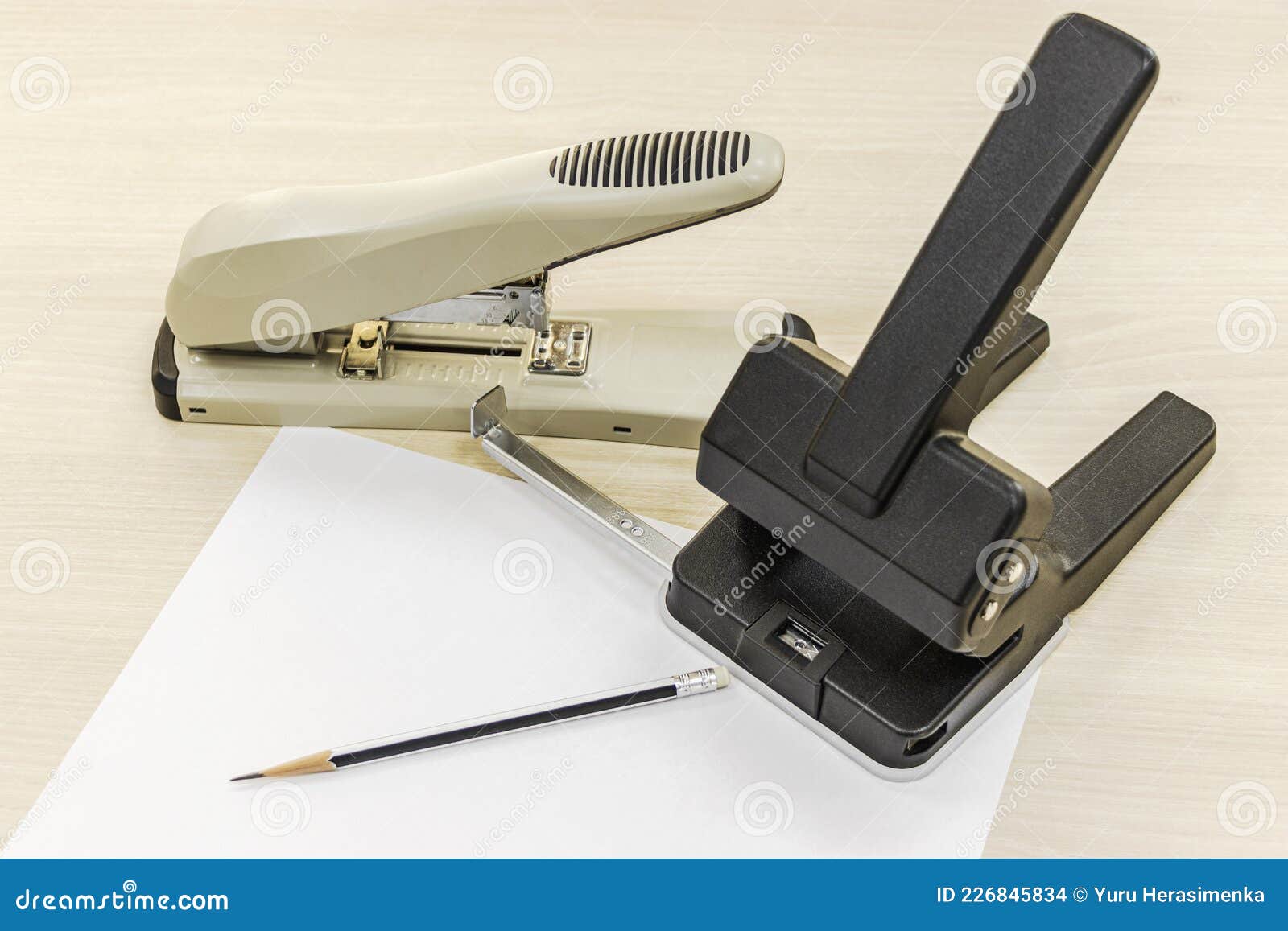Hole Punch and Stapler on the Office Desk. Office Tools. Copy Space ...
