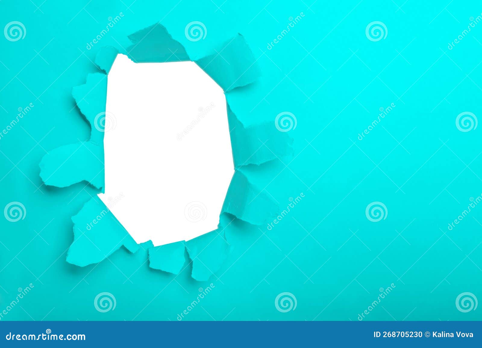 A hole in turquoise paper stock photo. Image of cracked - 268705230