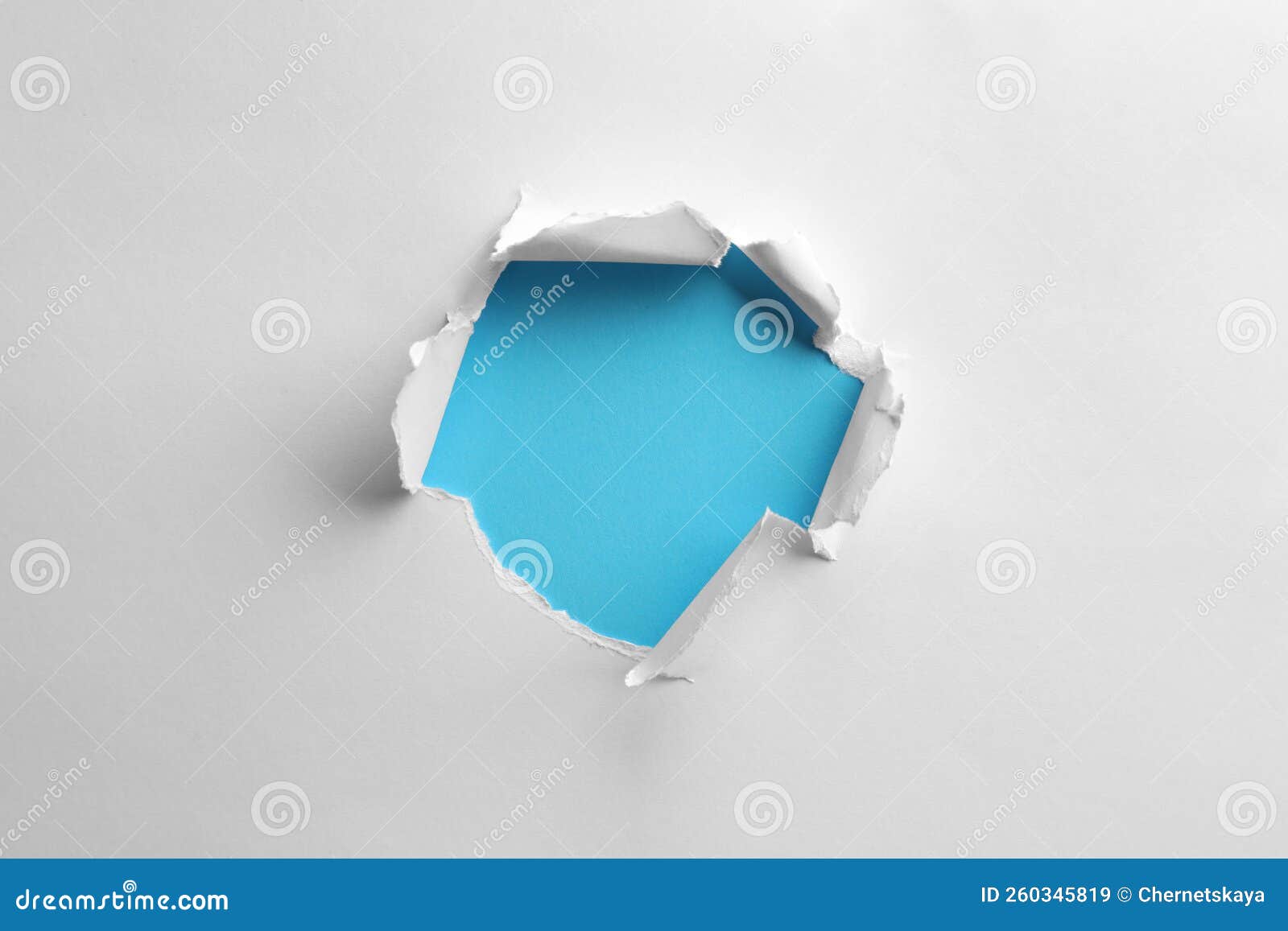 Hole in White Paper on Light Blue Background Stock Image - Image of ...