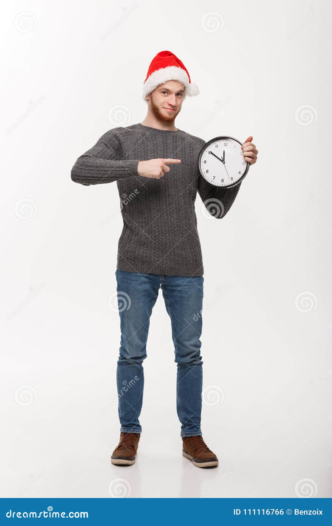 Holiday Concept - Young Handsome Beard Man Pointing on White Clock ...