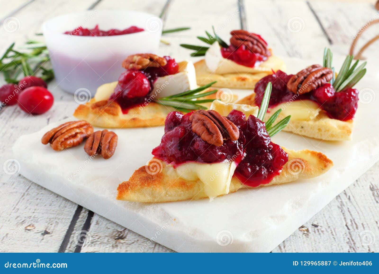 Holiday Flatbread Appetizers with Cranberries and Brie, Close Up on a ...