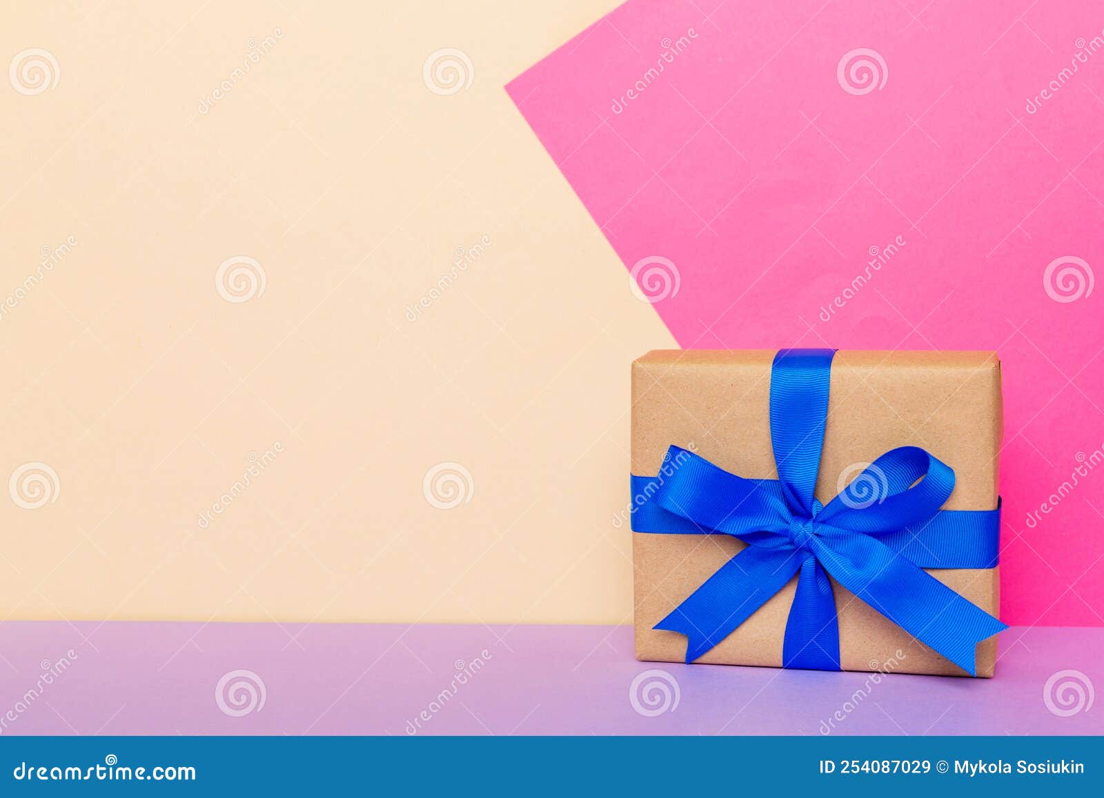Holiday Handmade Paper Present Tied Blue Ribbon Bow Top View With Copy Space Flat Lay Holiday