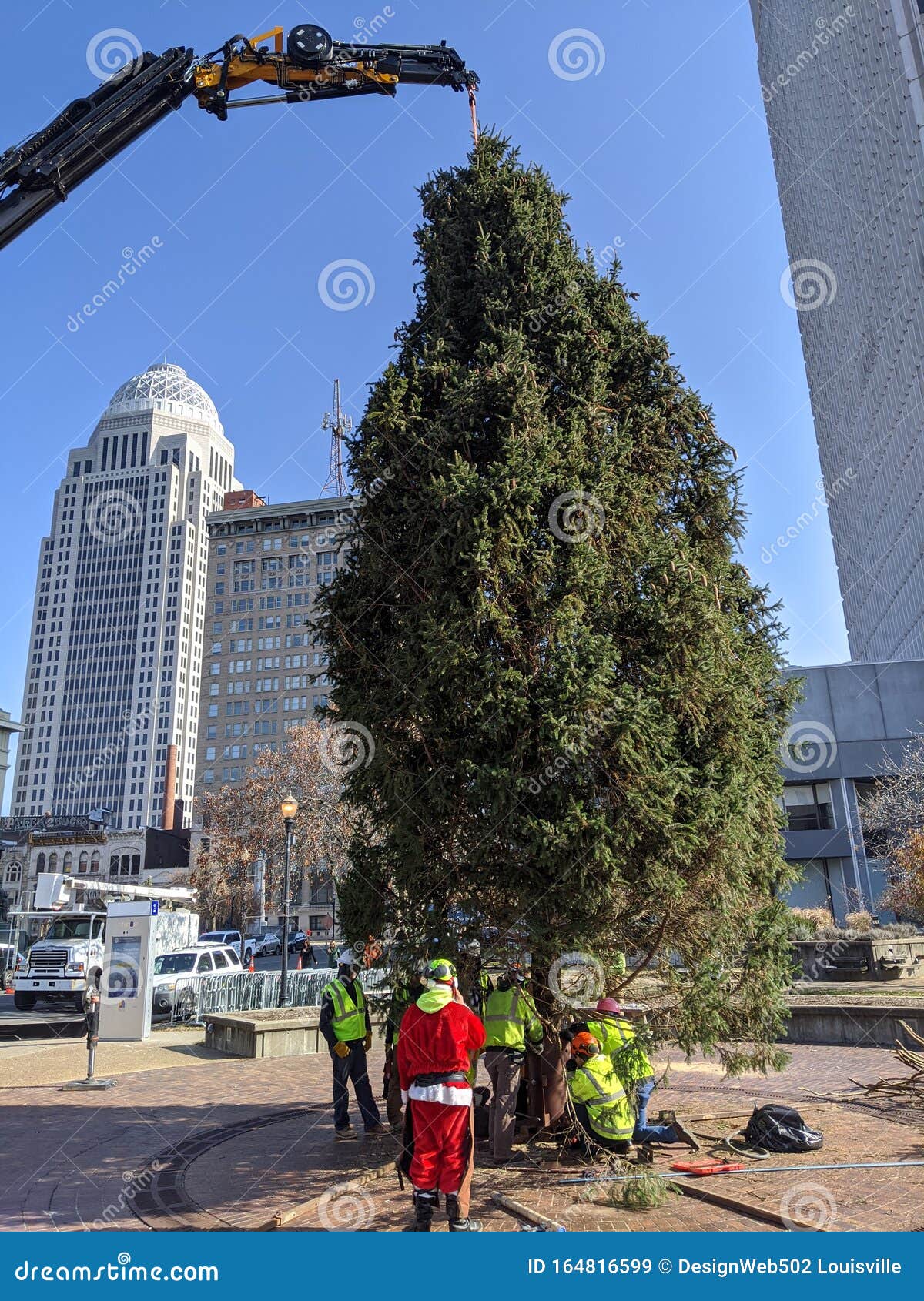 Holiday tree on a crane editorial stock image. Image of santa - 164816599