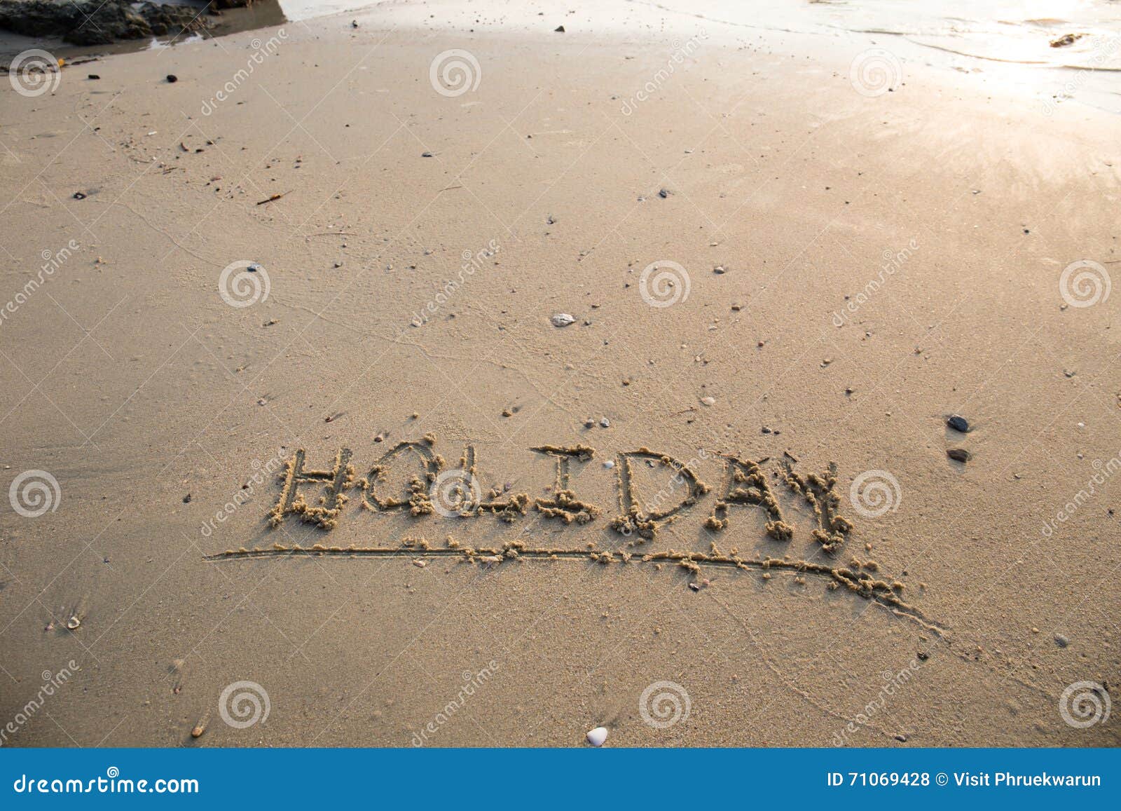 Holiday Written in the Sand at the Beach Waves in the Background Stock ...