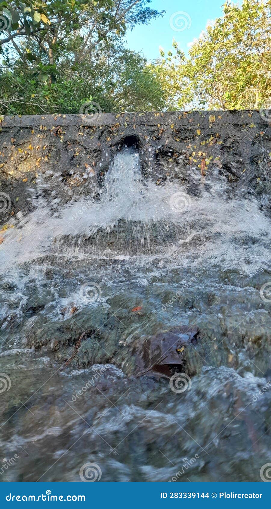 A Hollow River Dam that Still Has Water Flowing through it Stock Photo ...