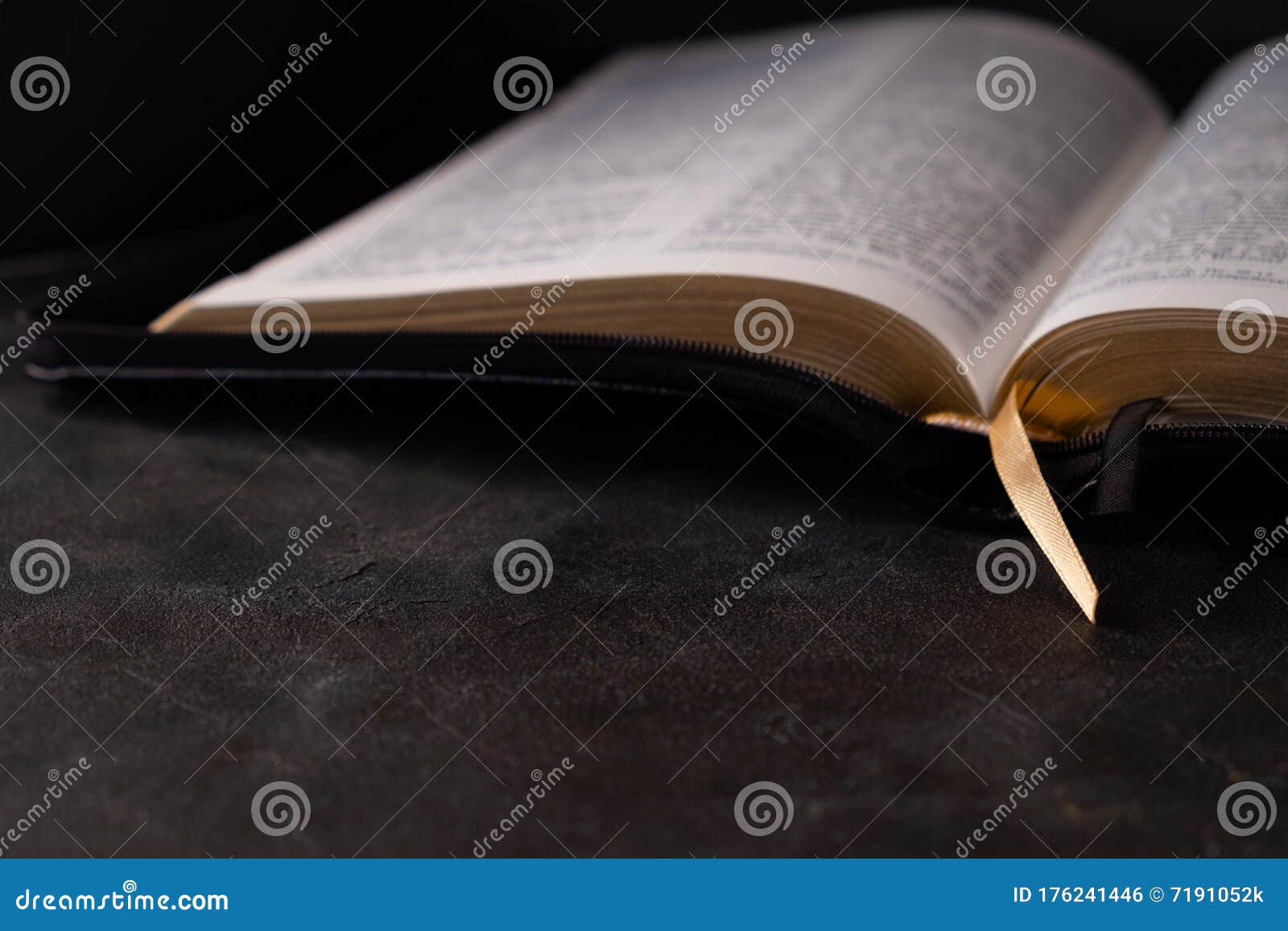 The Holy Bible on Dark Background. Christianity Concept Stock Photo ...