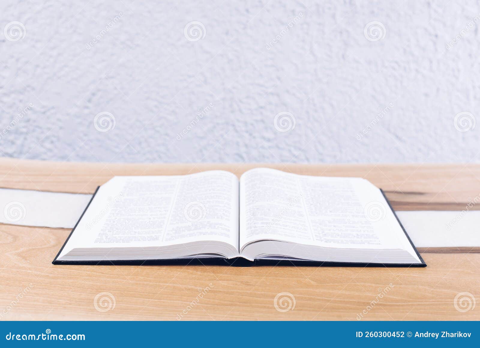 The Holy Bible is Open. a Book on a Wooden Table. Stock Photo - Image ...