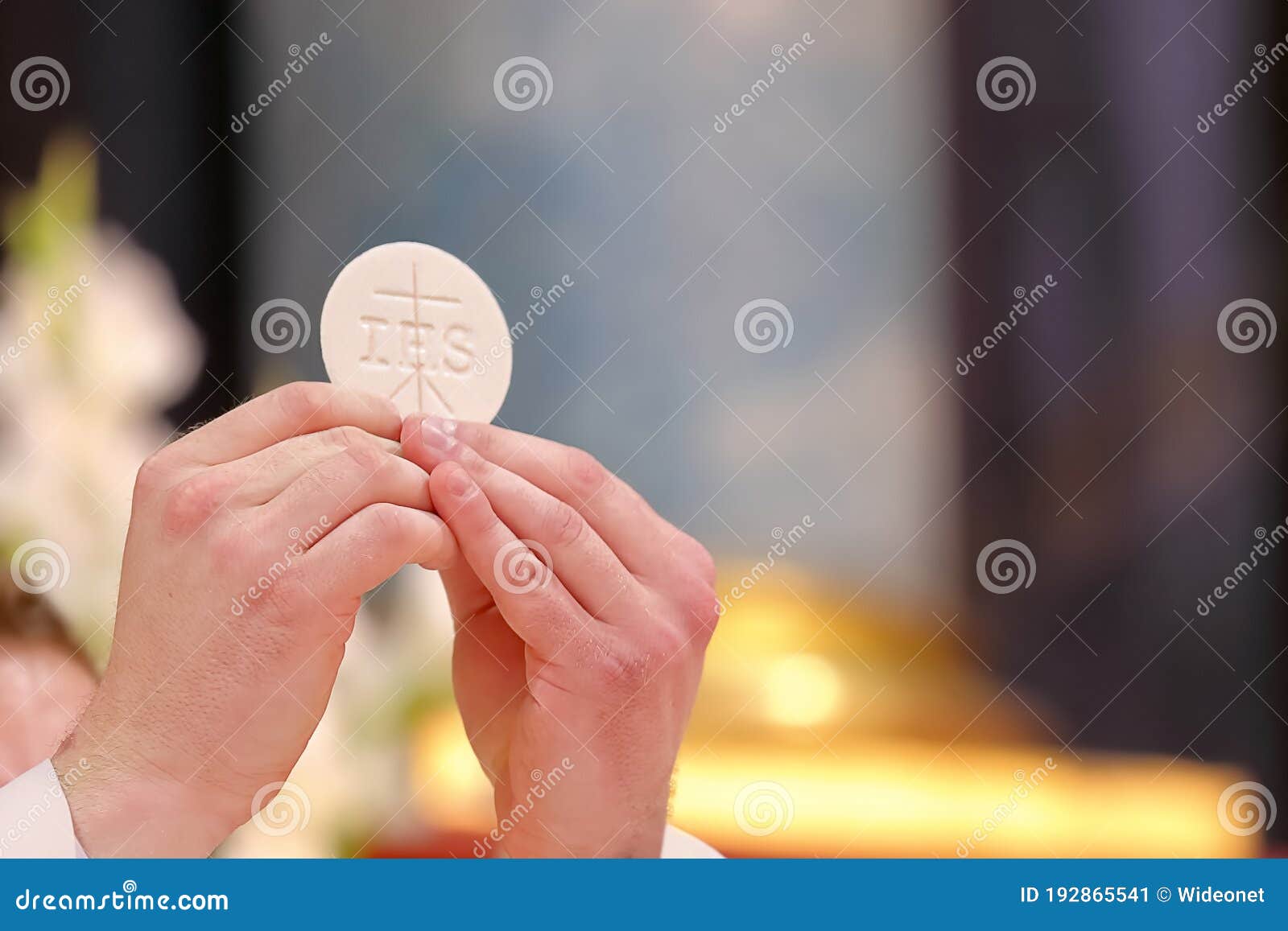 Holy Host in the Hands of the Priest on the Altar during the ...
