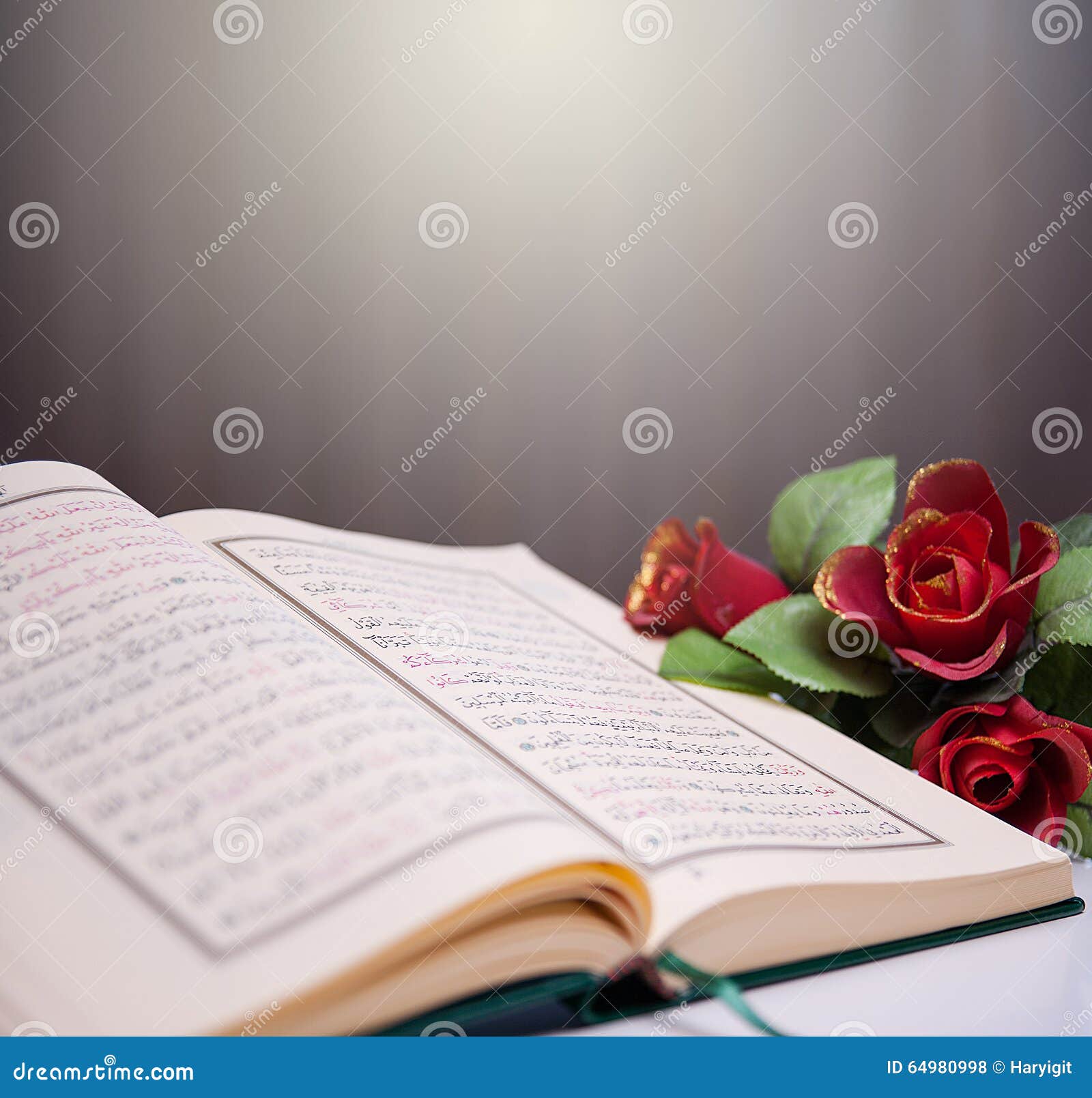 Holy Quran and roses. stock photo. Image of equipment - 64980998