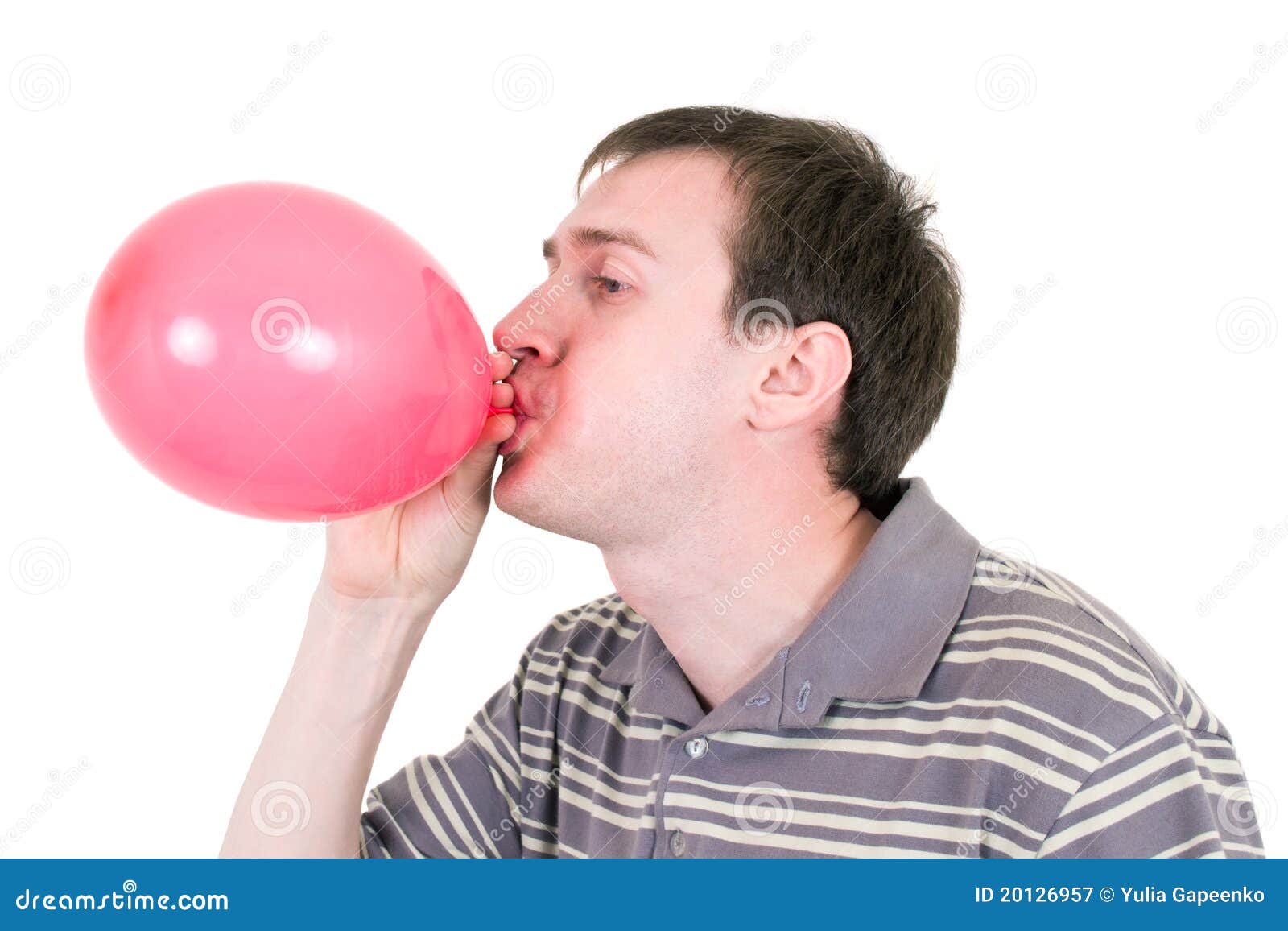 Hombre Que Infla El Globo Rojo Imagen de archivo - Imagen de ojos ...